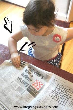 Fine motor exercise using newspaper - Laughing Kids Learn
